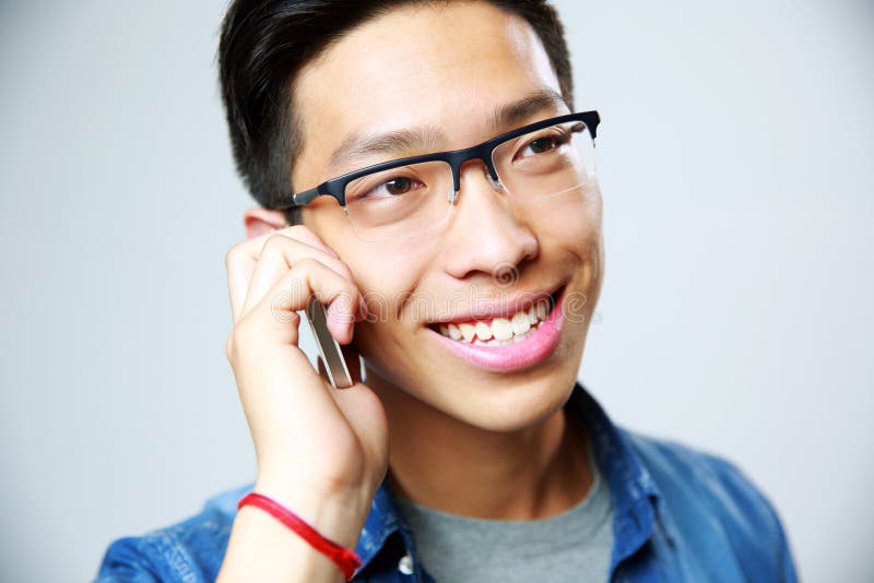 Young Asian Man Talking on the Phone Stock Image - Image of male, light ...