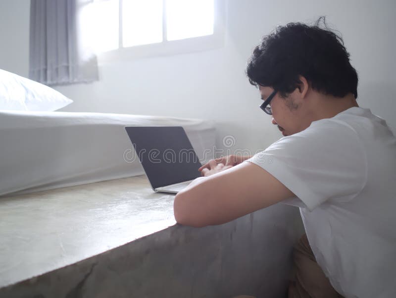 Young Asian Man Using Computer Laptop in Living Room. Internet of ...
