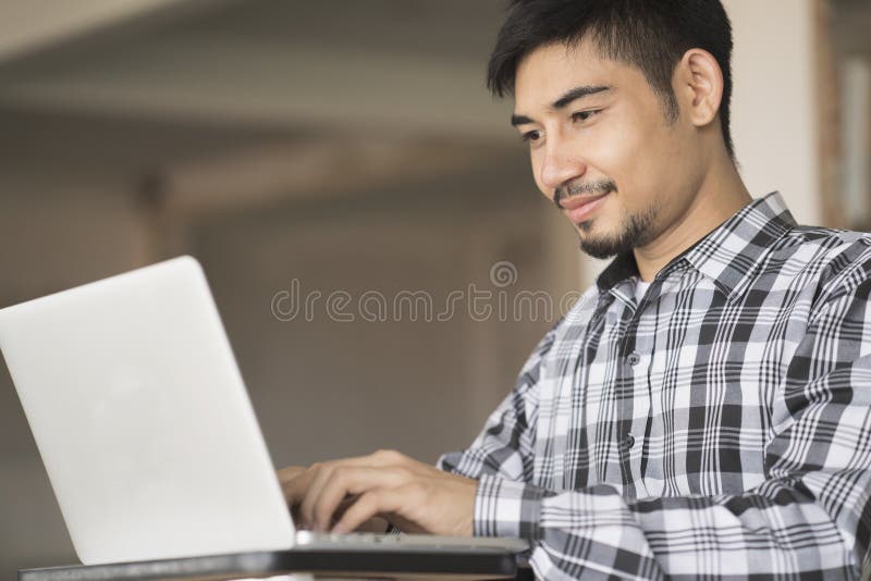 Young Asian Man Using Laptop at Home Stock Image - Image of leisure ...