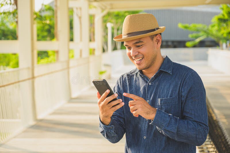 Young Asian Man Using Smartphone. Stock Photo - Image of lifestyle ...