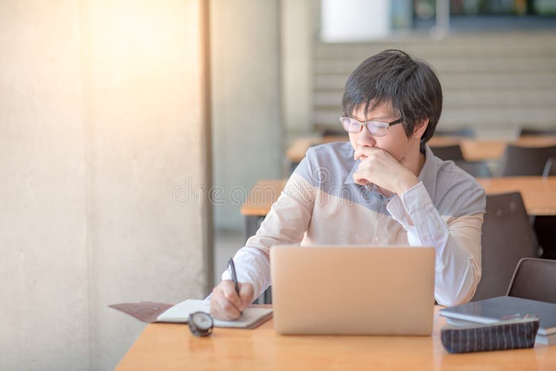 Young Asian Man Working with Laptop in College Stock Image - Image of ...