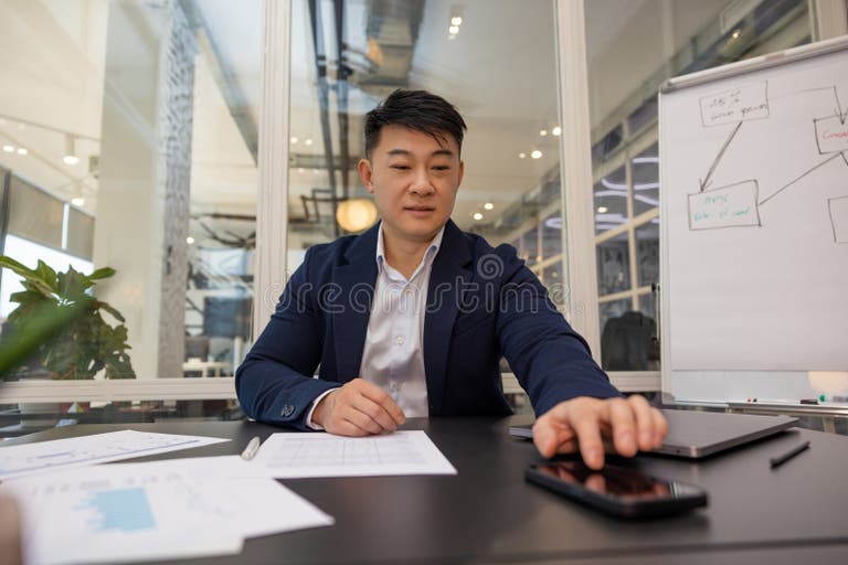 Young Asian Manager Working in the Office on a New Project Stock Image ...