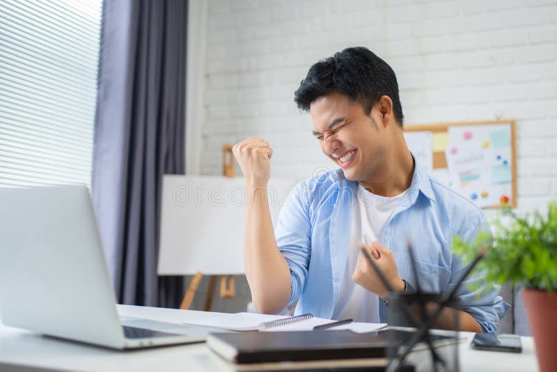 Young Asian Men Celebrate Success in the Workplace Stock Image - Image ...