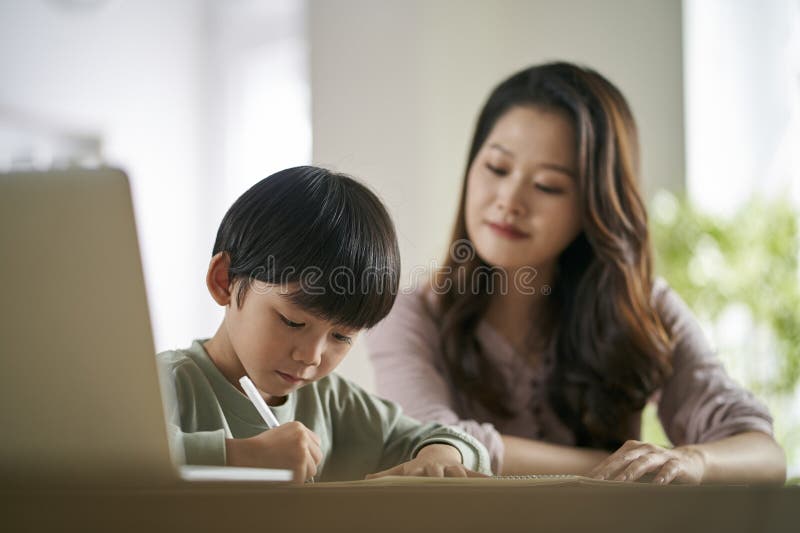Young Asian Mother Helping Son with Homework Stock Image - Image of caring, asia: 286830865