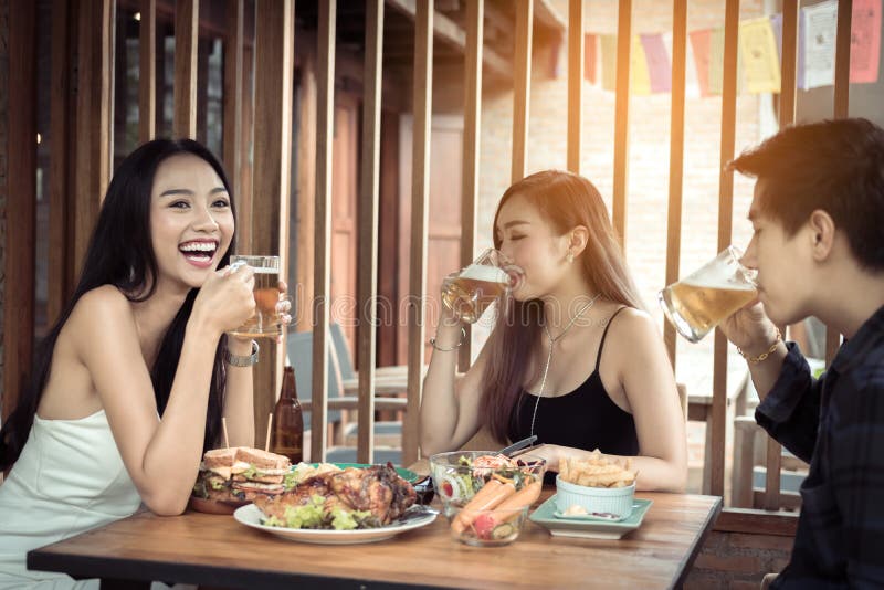 Young Asian People Having Fun at Drinking with Cheering with Beer at ...