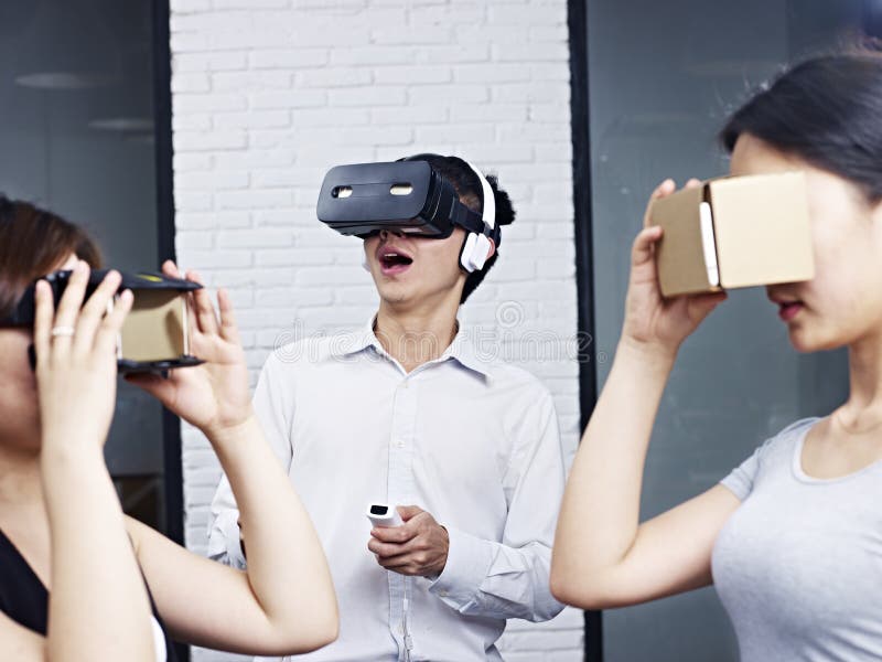 Young Asian People Trying Virtual Reality Goggles Stock Image - Image ...