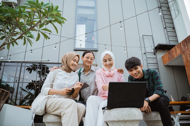 Young Asian People Using a Laptop while Together in Cafe Stock Image ...