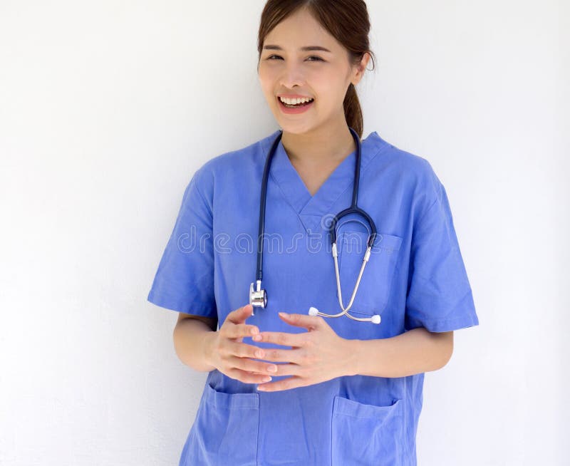 Young Asian Physical Therapist in Blue Uniform and Stethoscope Stand ...