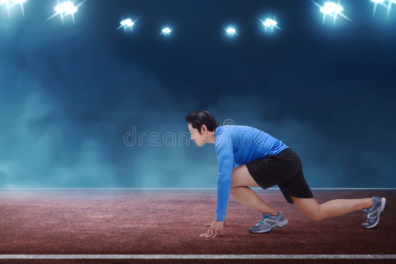 Young Asian Runner Man Kneeling Ready in Start Position Stock Image ...