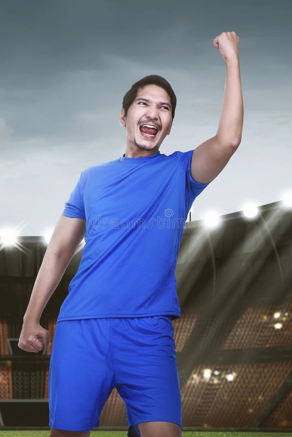 Young Asian Soccer Player with Excited Expression Stock Image - Image ...