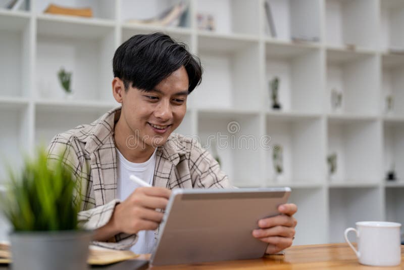 Young Asian Student Using Digital Tablet Remote Studying, Watching ...