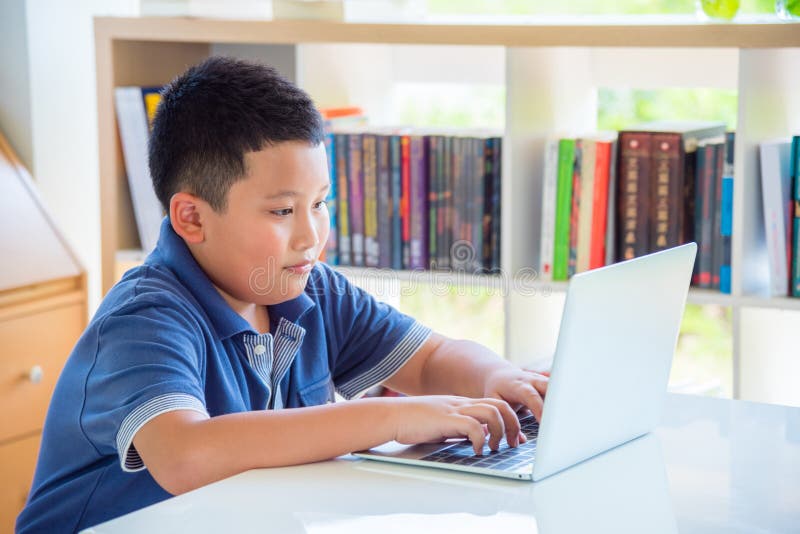 Young Student Using Laptop Computer in School Stock Image - Image of ...