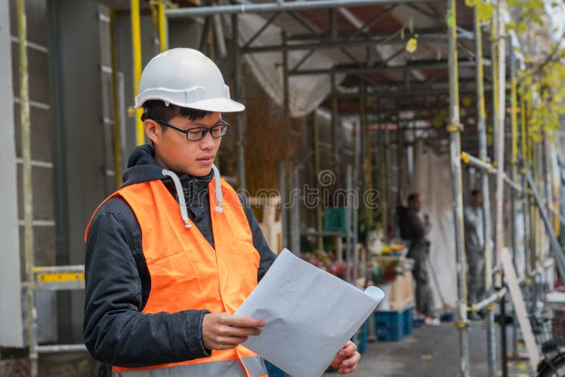 Young Asian Trainee Engineer at Work on Construction Site Stock Image ...
