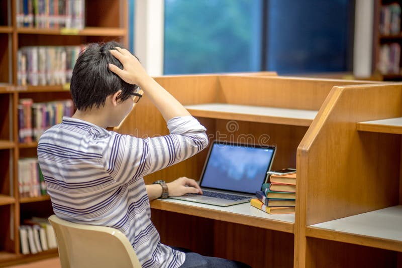 Young Asian University Student in Library Stock Photo - Image of ...