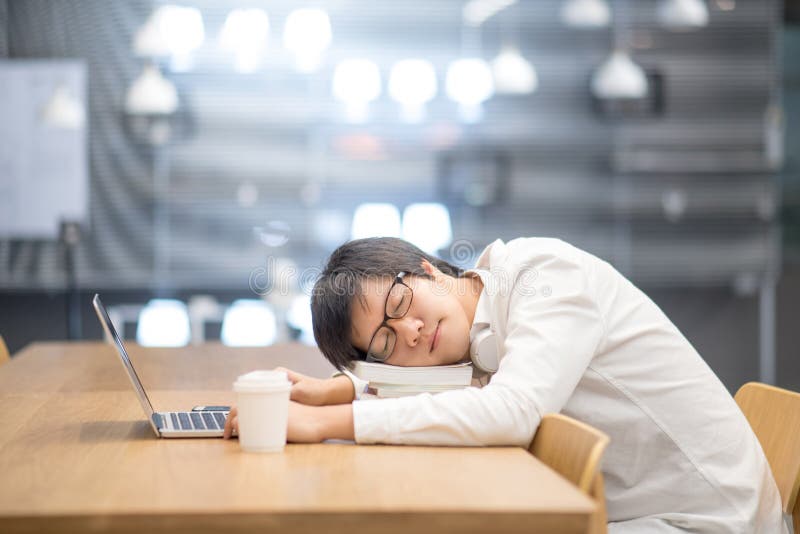 Young Asian University Student Take a Nap in Library Stock Image ...