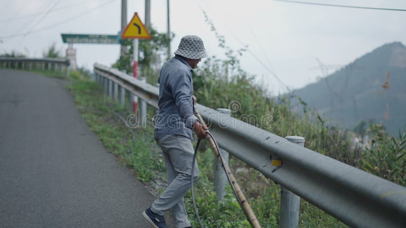 Young Asian Vietnamese Man Pulling an Electric Cable on the Road Stock ...
