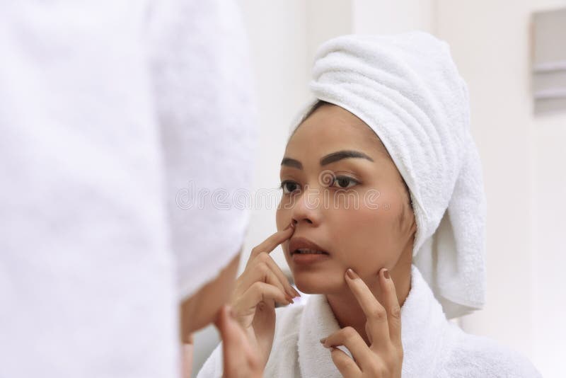 Young Asian Woman With Bath Towels Cleanses Her Face Stock Image