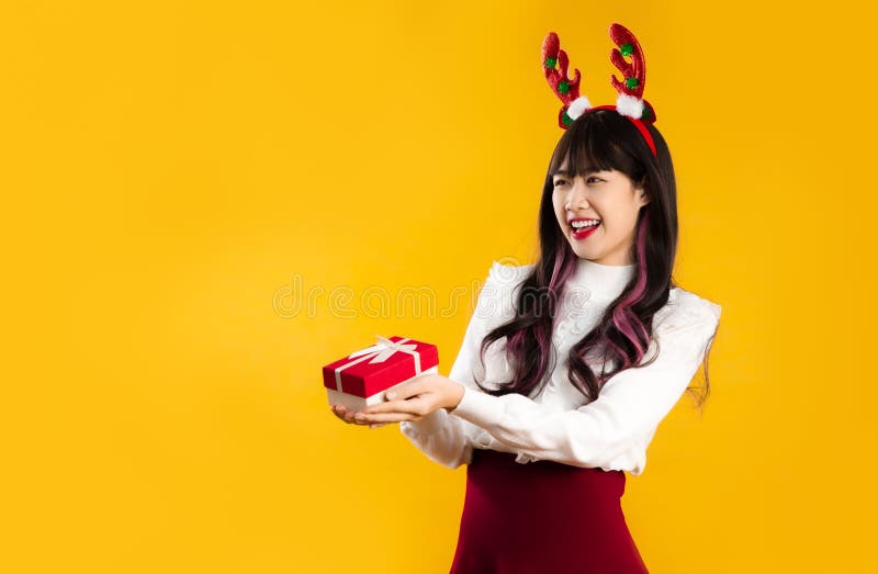 Young Asian Woman In Christmas Theme Costume Red And White Wear