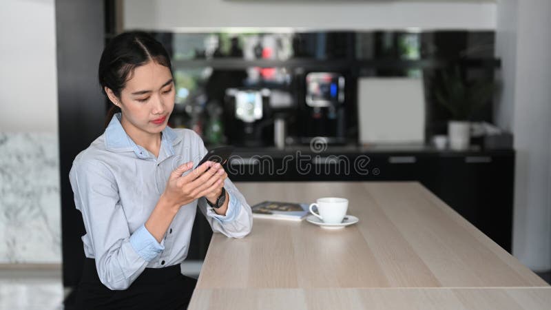 Woman Employee Using Mobile Phone during Coffee Break in Office. Stock ...