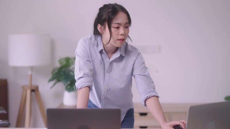 Young Asian Woman Hard Working with Documents at Her Using Laptop ...