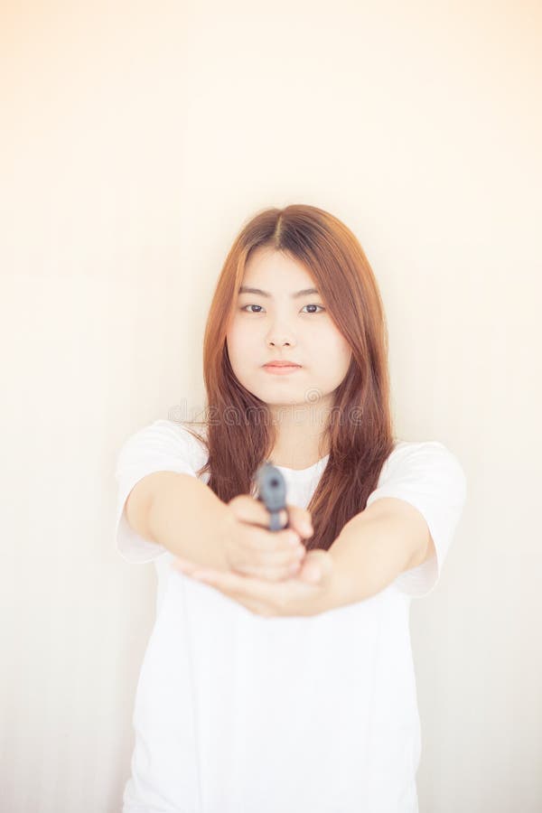 Young Asian Woman Holding the Gun Stock Image - Image of muzzle ...