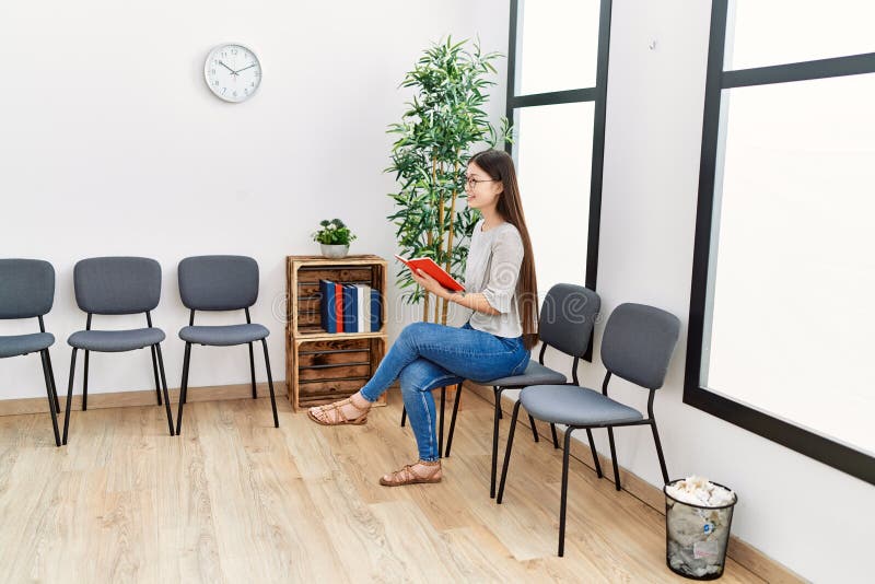 Young Asian Woman Reading a Book at Waiting Room Stock Image - Image of ...
