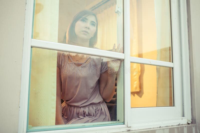 Young Sad and Depressed Asian Chinese Woman Looking Thoughtful through ...