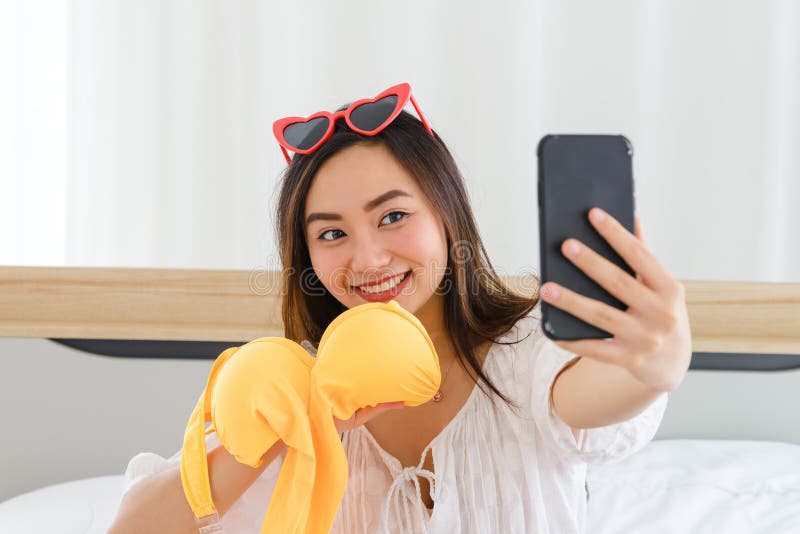 Young Asian Woman Show Yellow Bikini While Talking To Facetime Calling