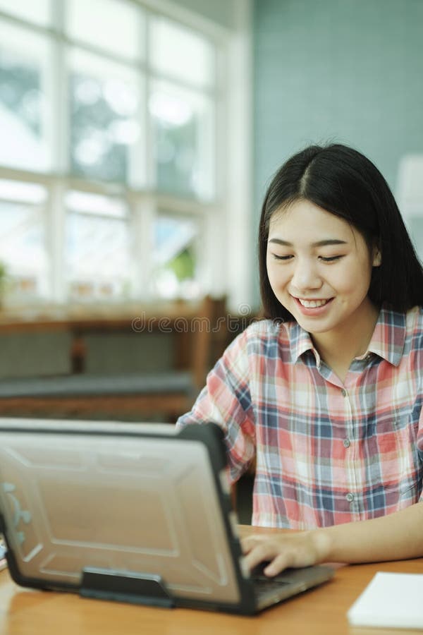 Young Asian Woman Study in Front of the Laptop Computer and at Offsite ...