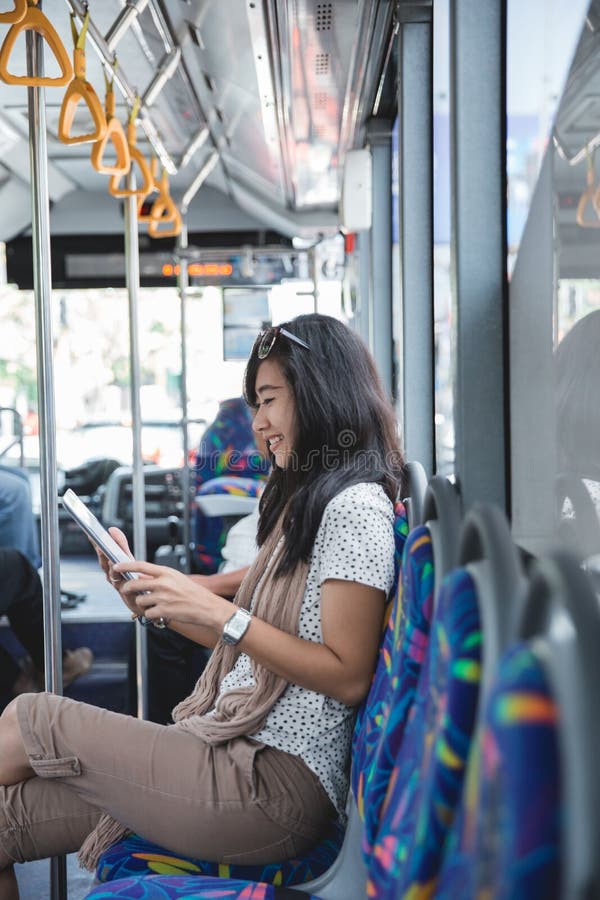 Young Asian Woman Using Her Digital Tablet on the Bus Stock Image ...