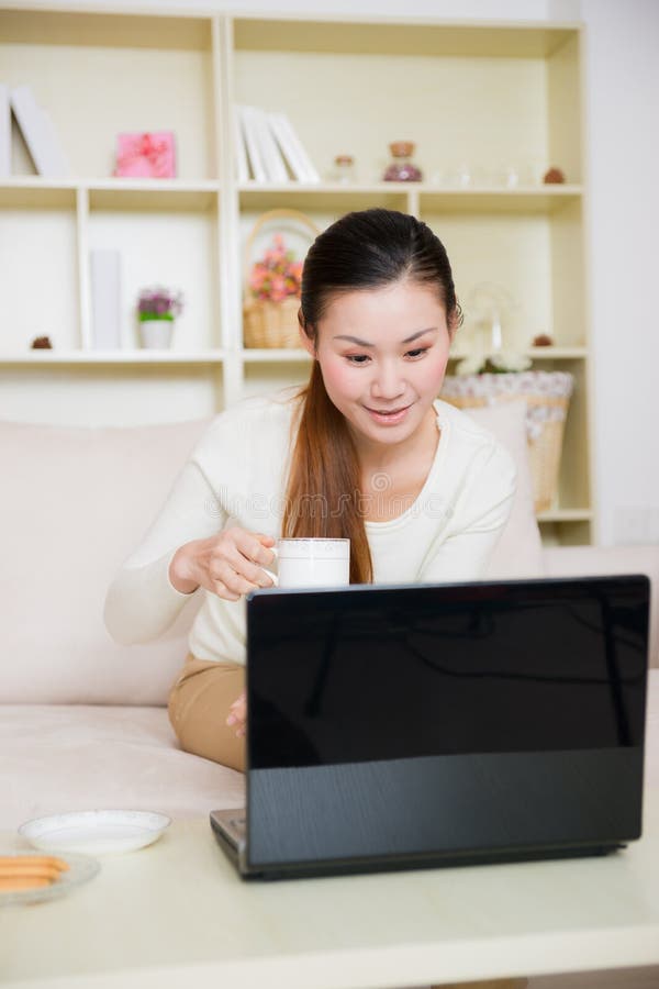 Young Asian Woman Using a Laptop Stock Image - Image of smile, home ...