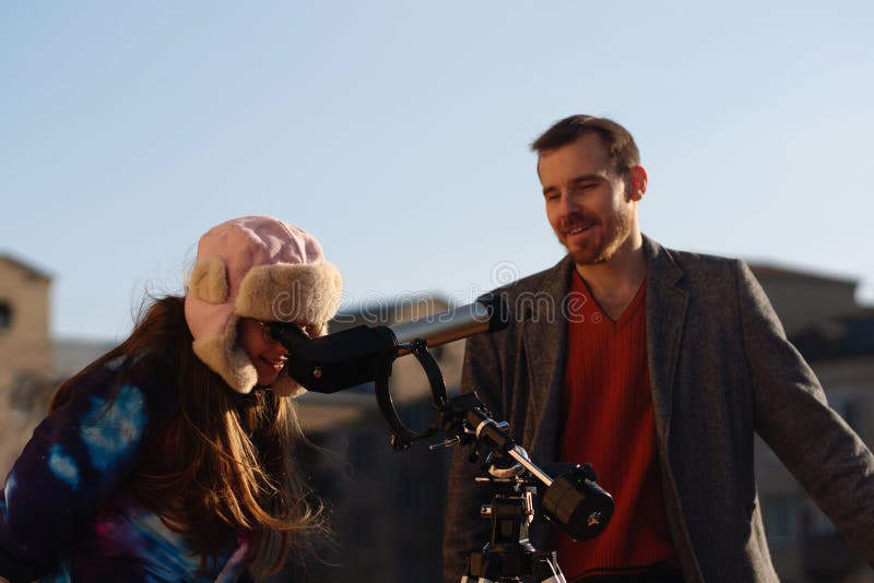 Young Astronomy Learner Observes Sun, Guided by Teacher on Rooftop ...