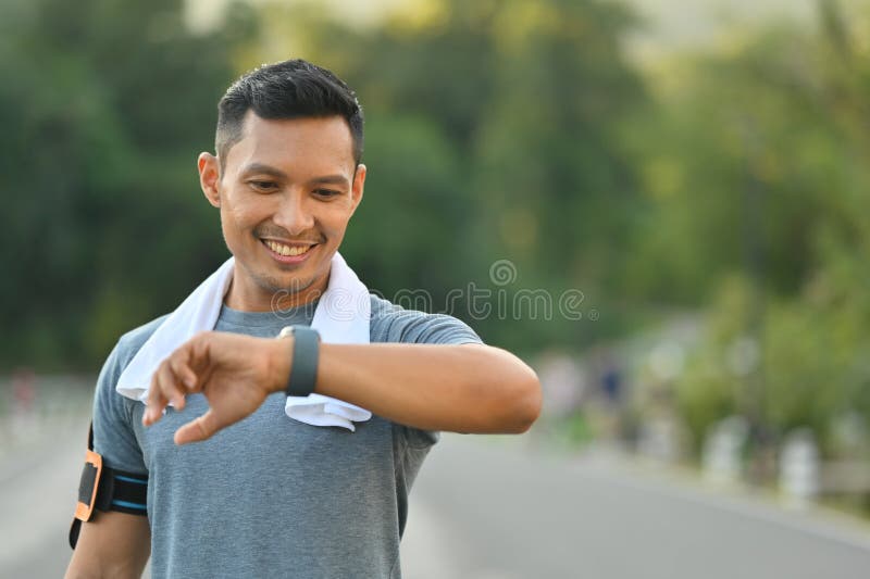 Young Athlete Checking Fitness Progress on His Smart Watch after ...