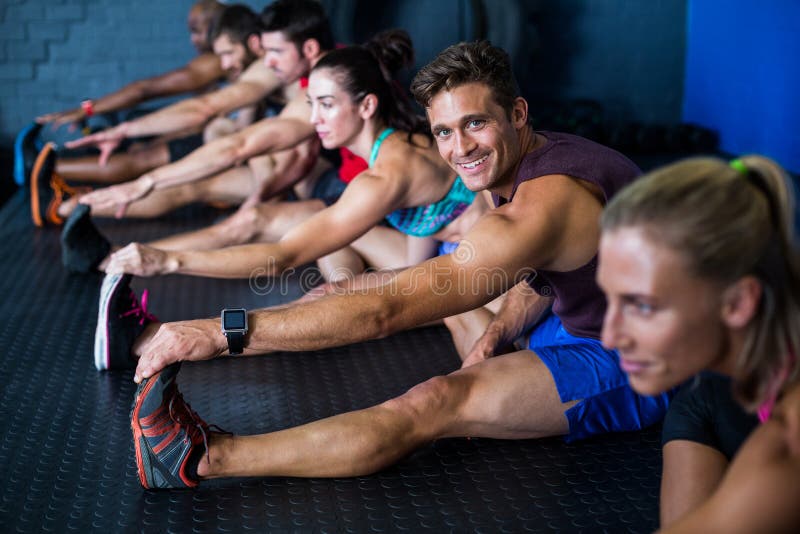 Young Athlete Friends Stretching Stock Photo - Image of female, male ...