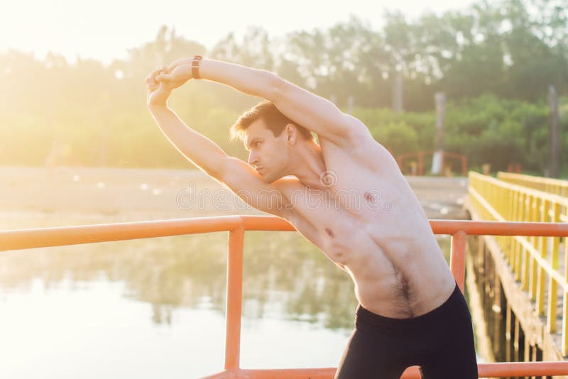 Young Athlete Man Doing Side Bend Exercise. Stock Photo - Image of ...