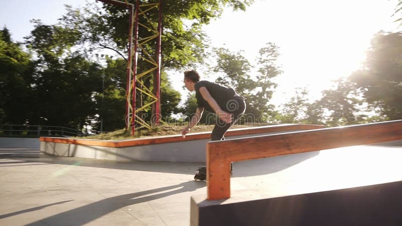 A Young Athlete Performs a Trick on Rollers - Jumps through the ...