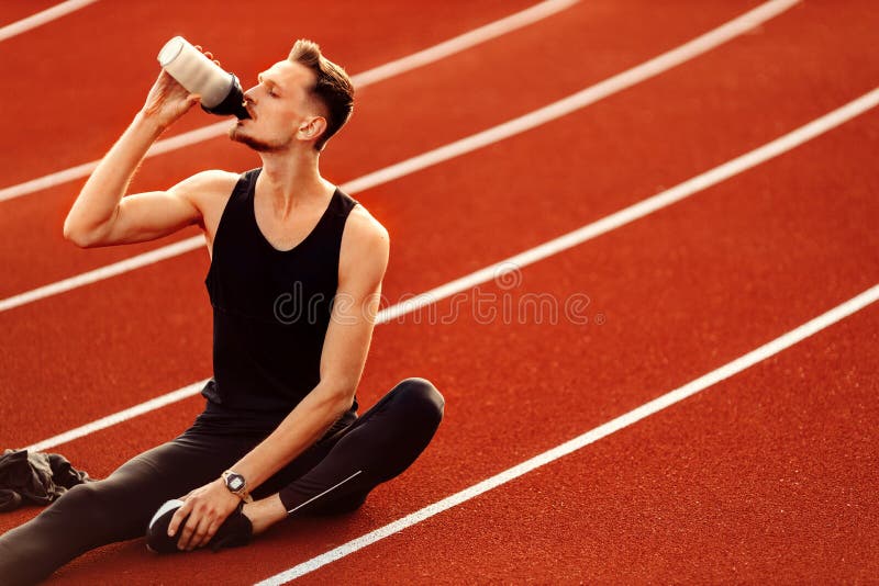 Young Athlete Resting after Running in the Stadium Stock Photo - Image ...