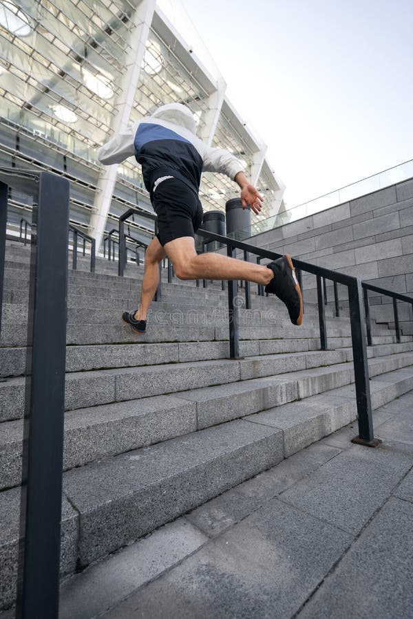 Young Athlete Training Outdoors, Jumping Over Steps Stock Photo - Image ...