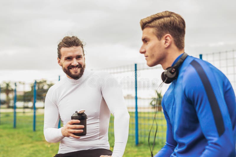 Athletes Practicing a Run on Athletics Stadium Track. Stock Photo ...
