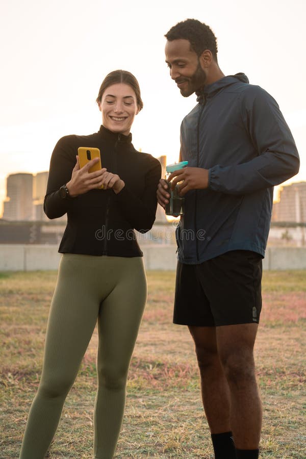 Young Athletes Using Apps on the Phone To Keep Track of Their Exercise ...