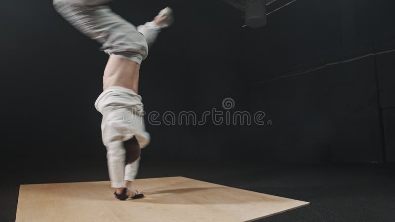 Young Athletic Man Dancer Spinning Around Leaning on His Hands ...