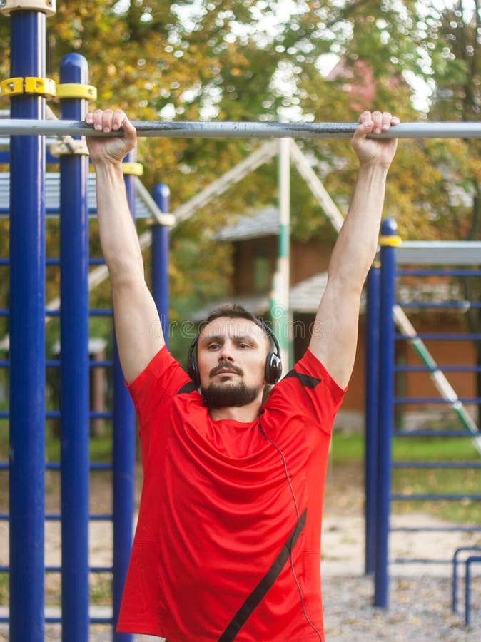 Young Athletic Man Doing Sport Exercises Outdoors in the Park Stock ...