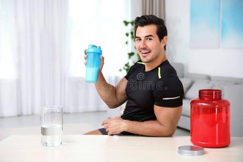Young Athletic Man with Protein Shake at Home Stock Photo - Image of ...