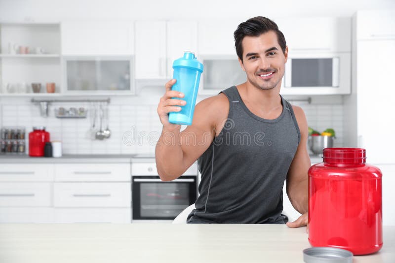 Young Athletic Man with Protein Shake Powder, Space for Text Stock ...