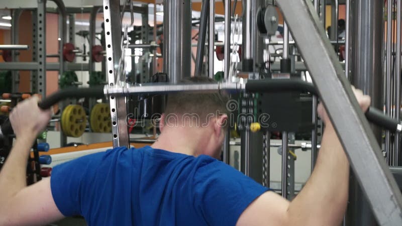 Young Athletic Man Trying Execute Back Muscle Exercises on Pulldown Bar ...