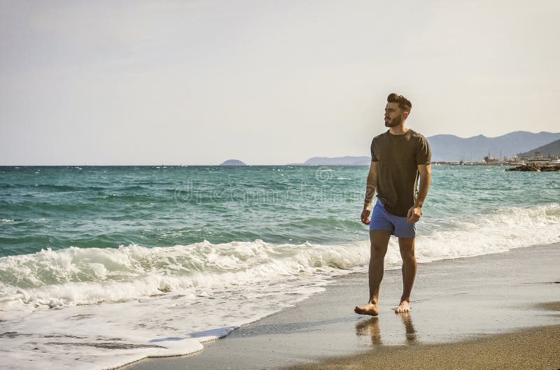 Young Athletic Man Walking at the Beach Stock Photo - Image of model ...