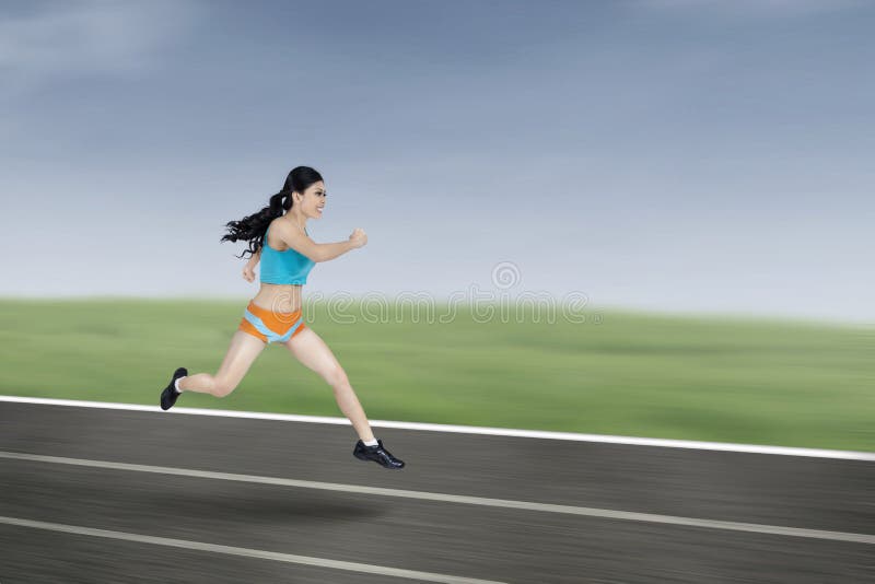 Young Athletic Woman Running Stock Photo - Image of athlete, jogging ...