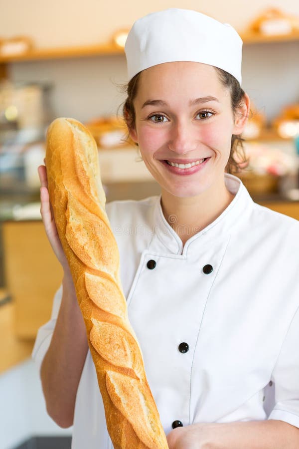 Young Attarctive Baker Working at the Bakery Stock Photo - Image of ...
