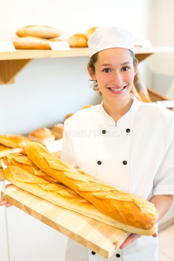 Young Attarctive Baker Working at the Bakery Stock Photo - Image of ...