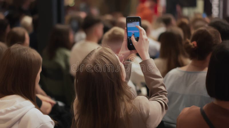 Young Attendees Absorb Information at a Technology Talk, Presenter with ...